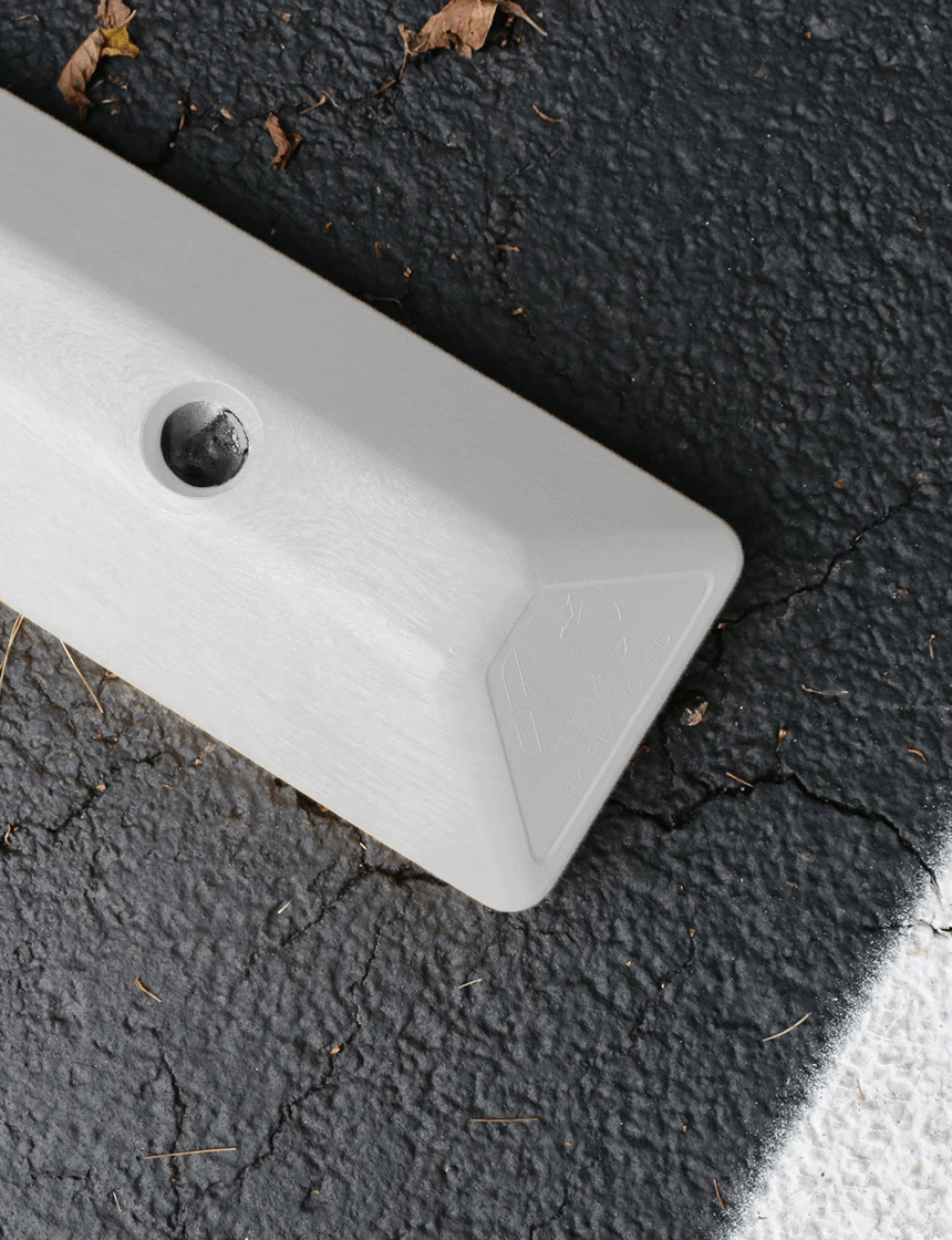 3' white commercial parking block with three wedge bolt fasteners ...